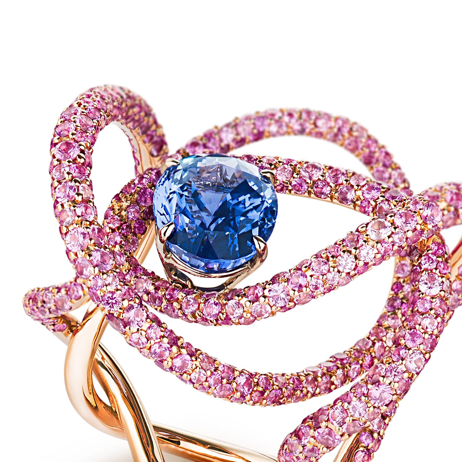 Ring with natural oval blue sapphire surrounded by rings of pink ...
